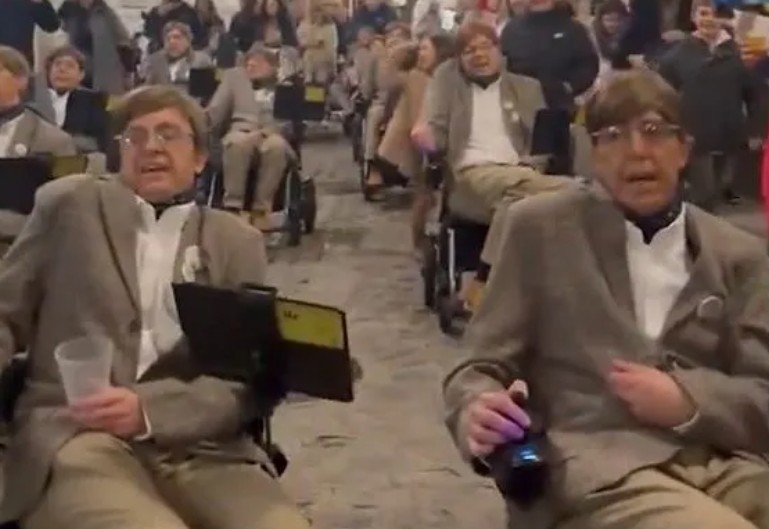 Dance group take the streets dressed as Stephen Hawking